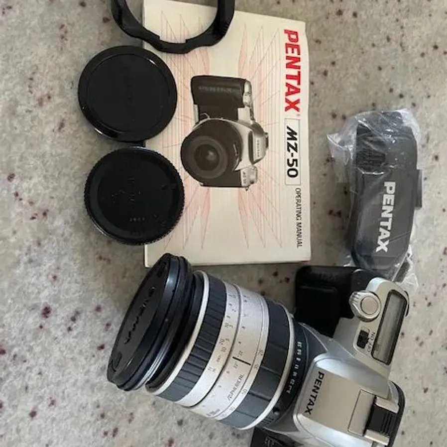 The Pentax MZ-50 is a classic 35mm film camera that has captured the hearts of photography ...