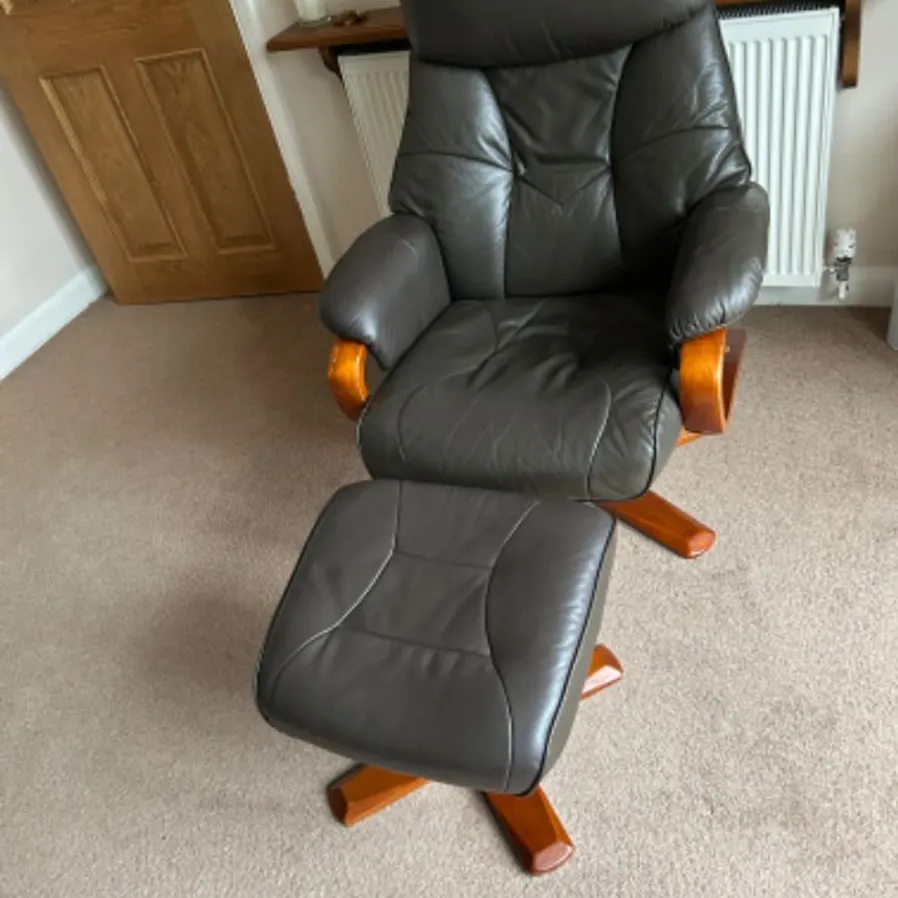 Rotating Leather Elegance: Swivel Chair & Footstool Set | 816 | jog it on